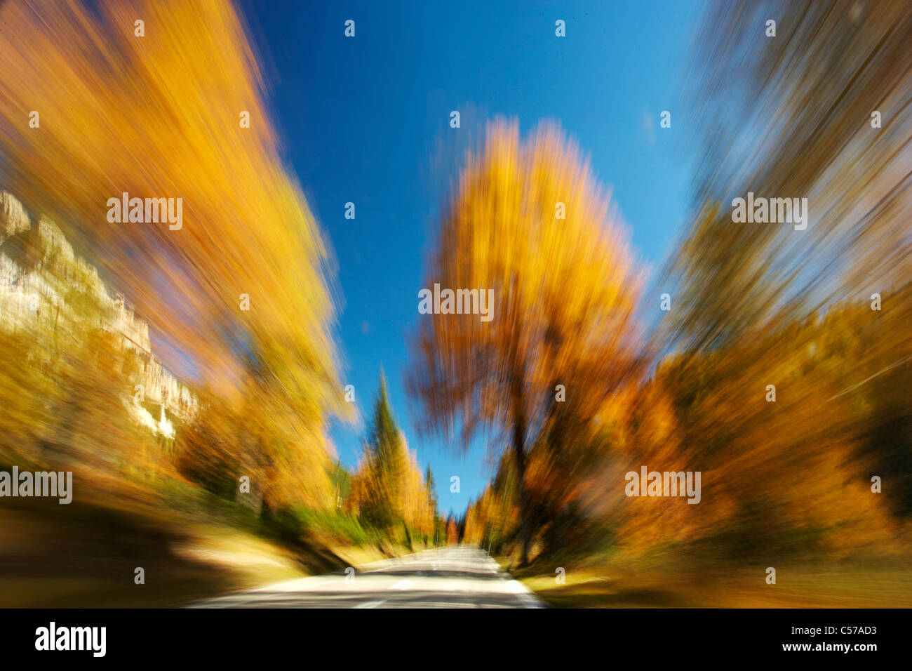 Speed blurred fall scenery and road Stock Photo - Alamy