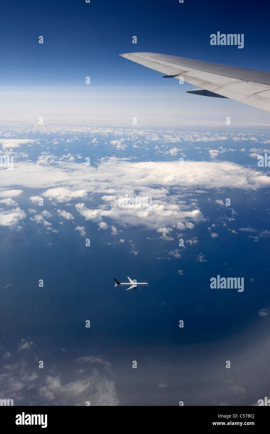 looking out aircraft window at delta airlines flight flying close below ...