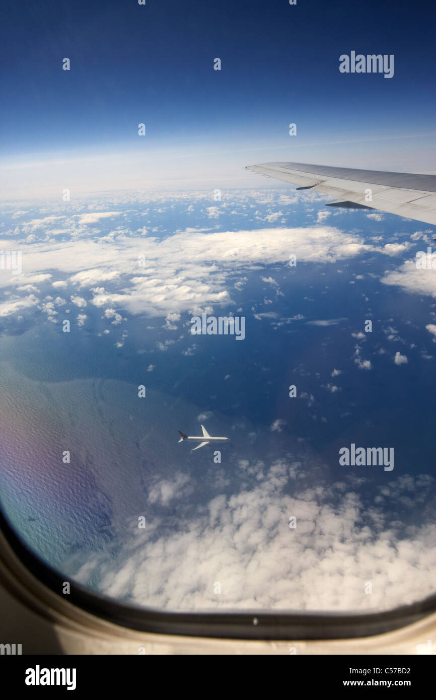 looking out aircraft window at delta airlines flight flying close below ...
