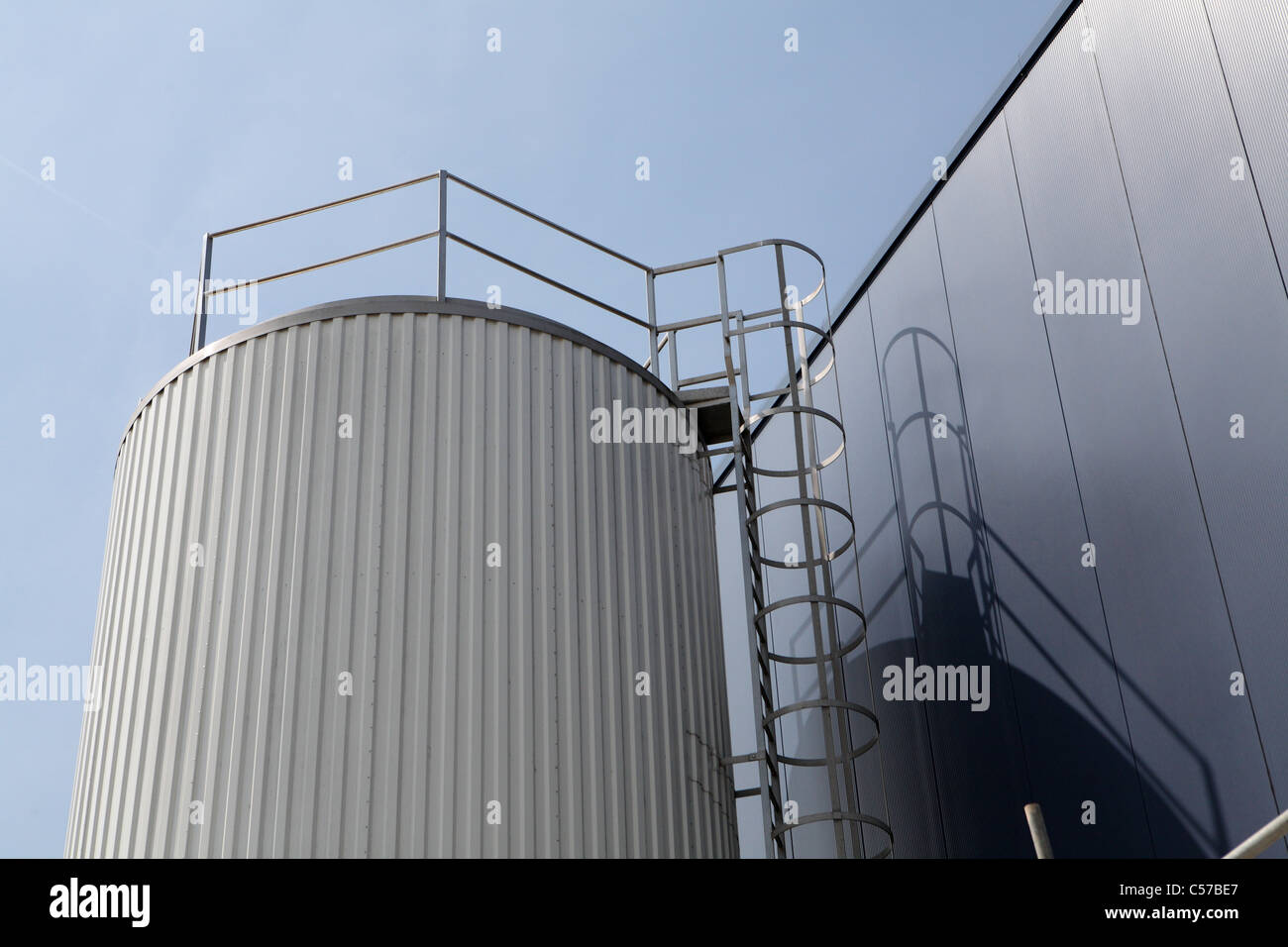 Ladder to top of industrial silo Stock Photo - Alamy
