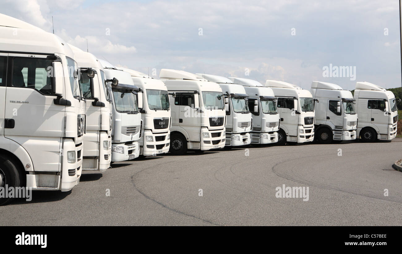 White lorry tractor units distribution depot Stock Photo - Alamy