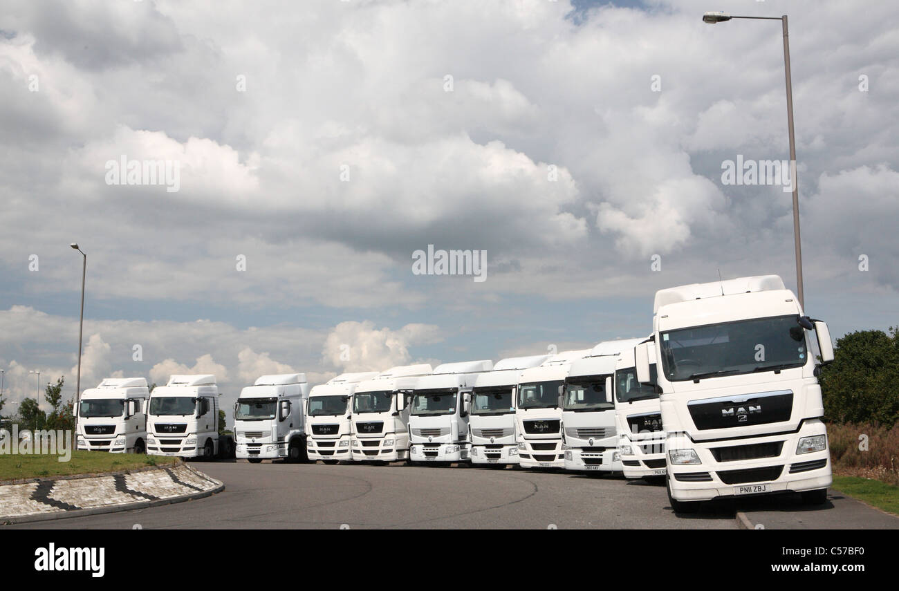 White lorry tractor units distribution depot Stock Photo - Alamy