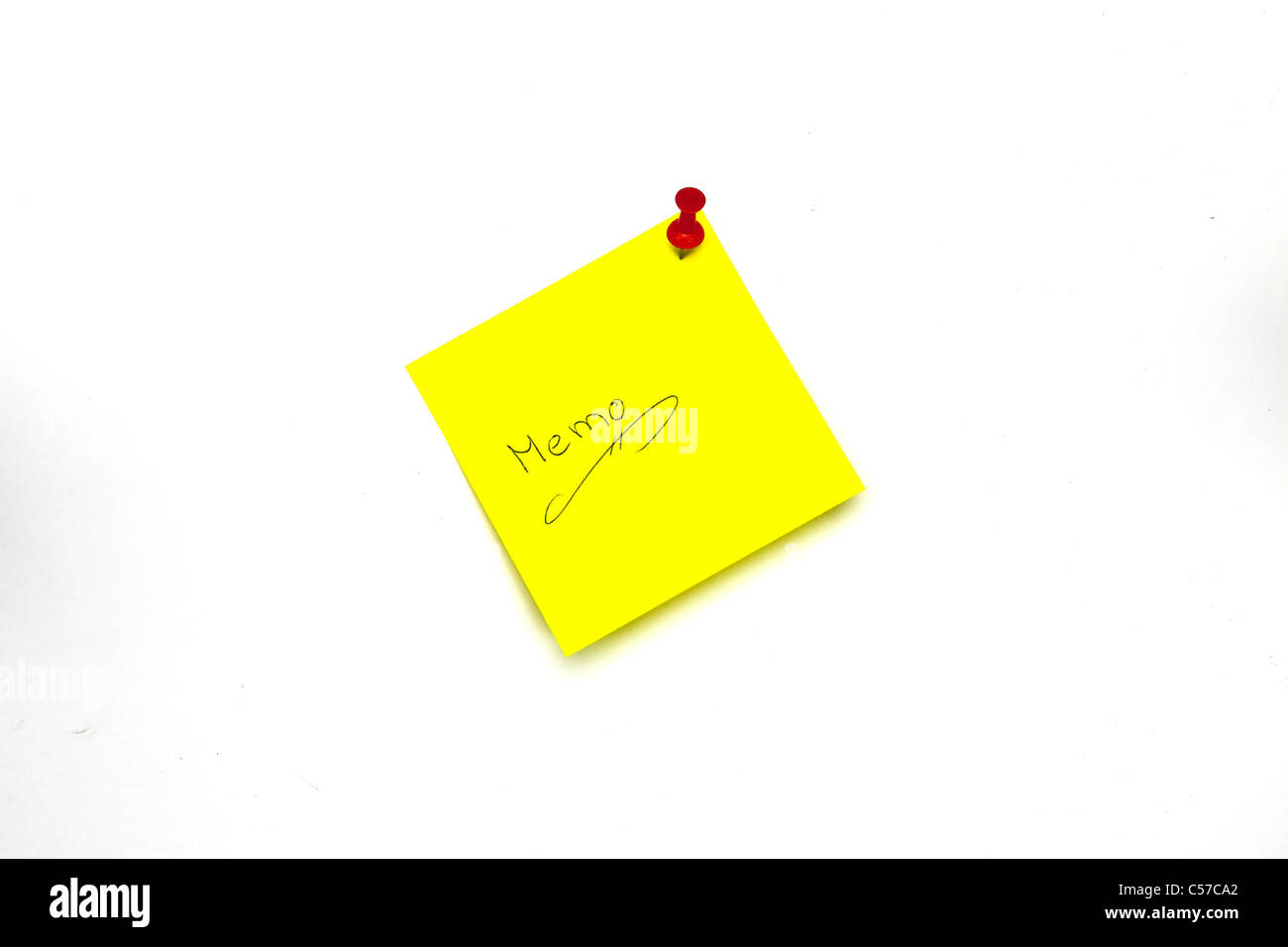 a yellow notepad with a red pin needle Stock Photo - Alamy