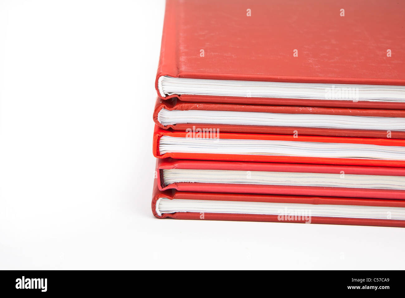 several red books on a white background Stock Photo - Alamy