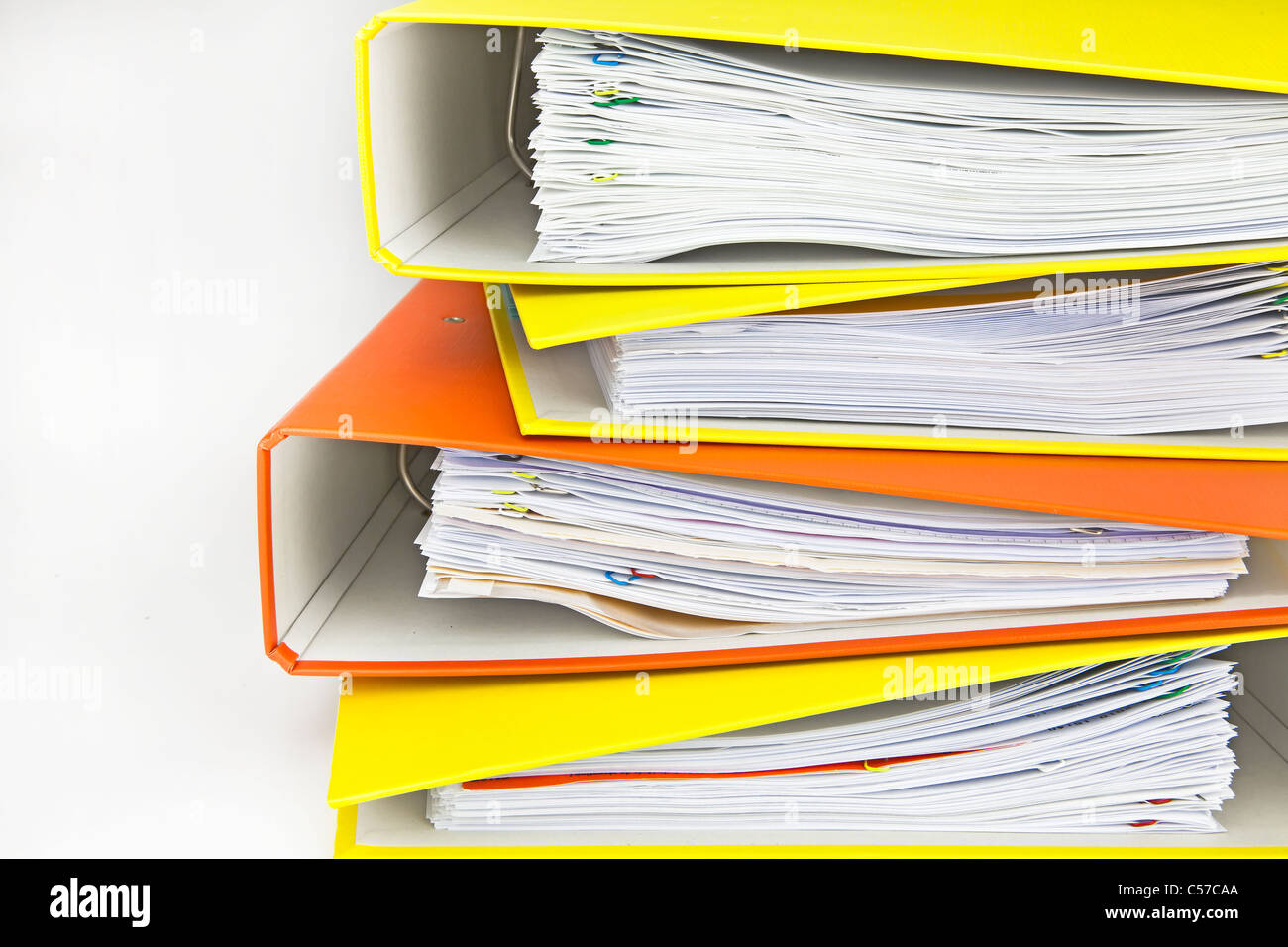yellow and orange file folders stacked on each other Stock Photo - Alamy