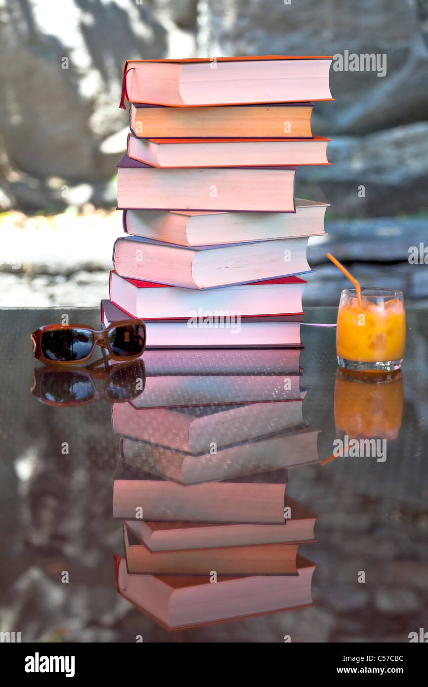 a stack of old books in the sun in summer Stock Photo - Alamy