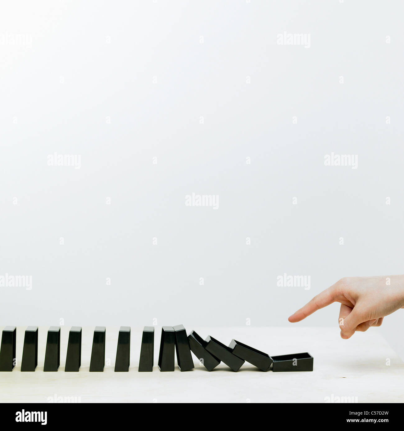 finger and fallen blocks Stock Photo - Alamy