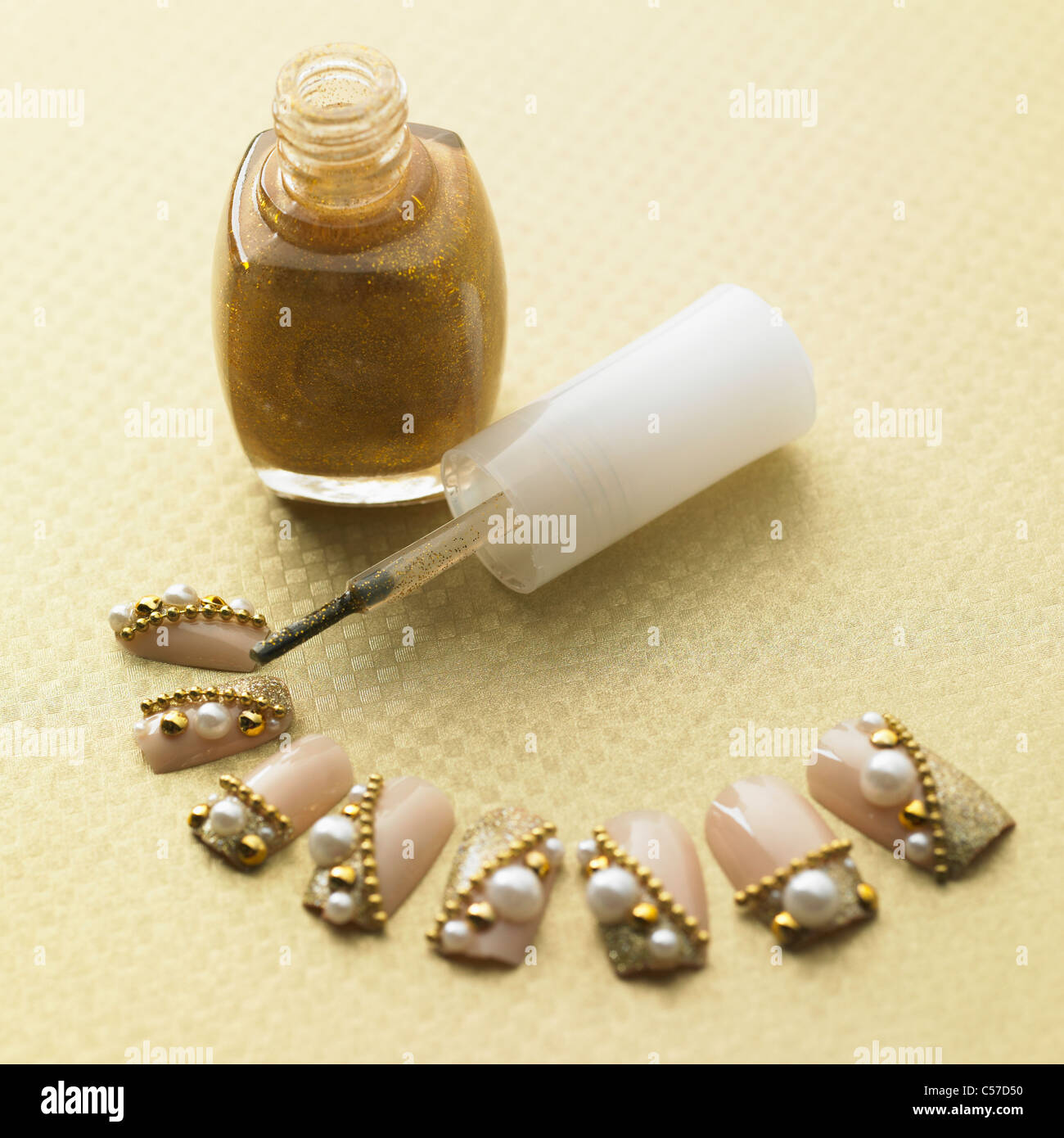decorated nail tips and nail enamel Stock Photo - Alamy
