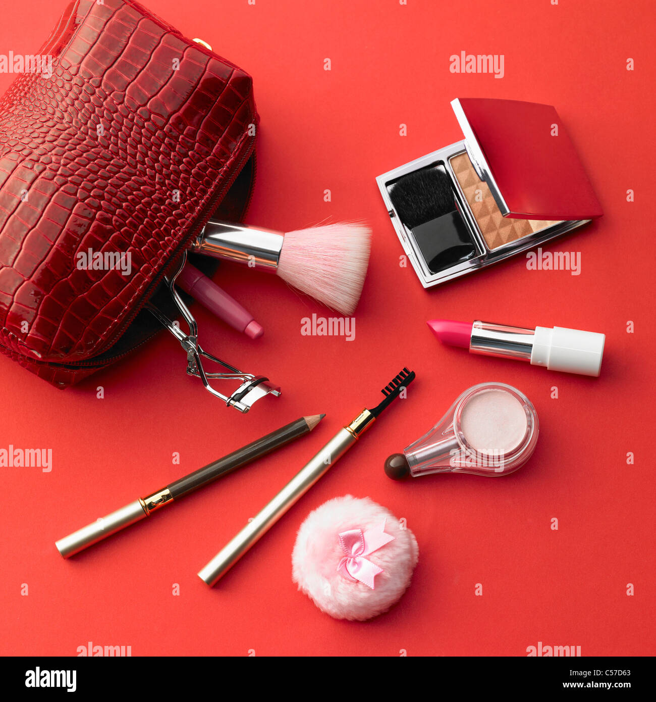 red pouch and makeup cosmetics Stock Photo - Alamy