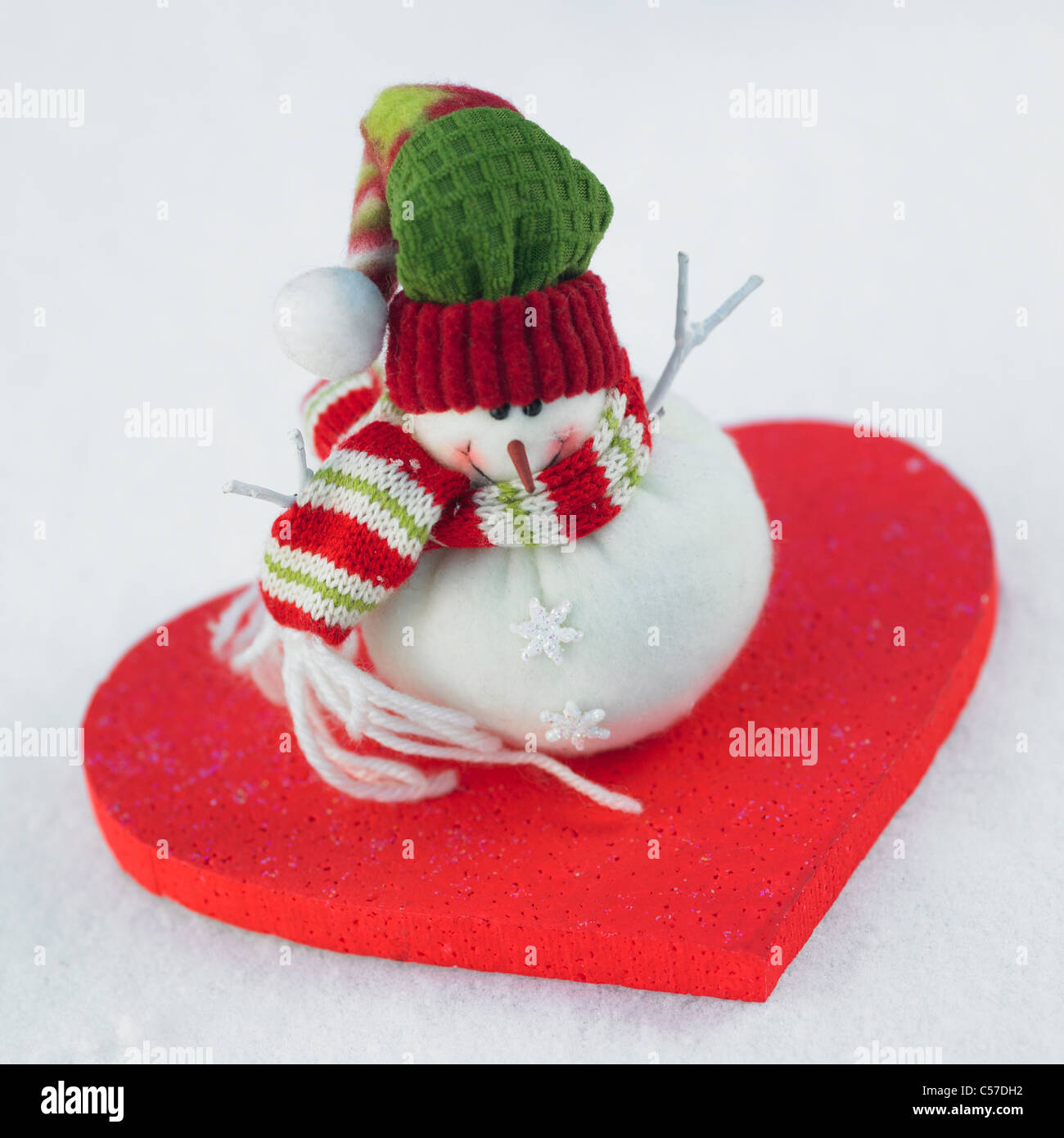 Snowman on the heart Stock Photo - Alamy