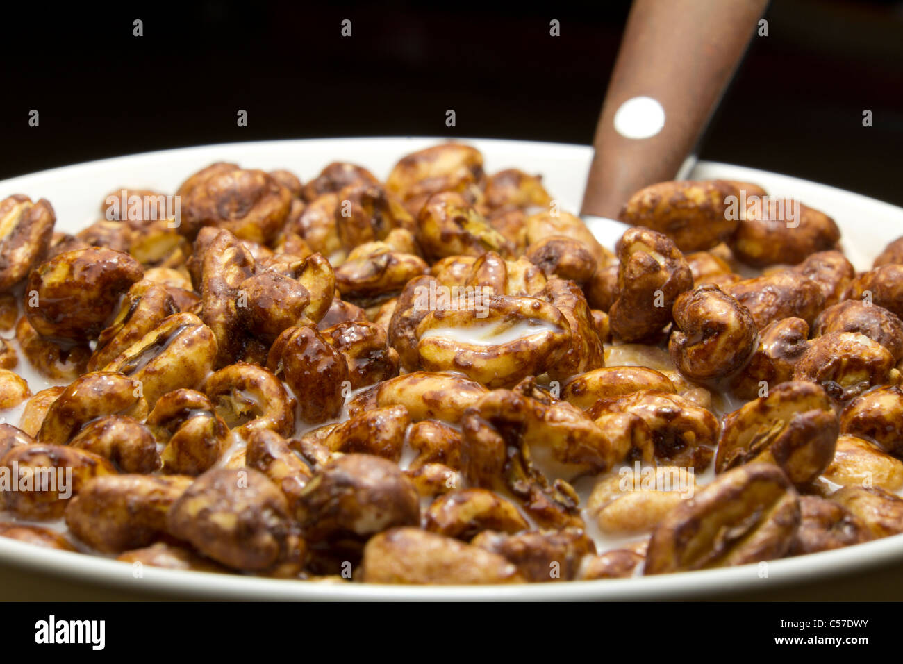 choco cornflakes with milk and a spoon Stock Photo - Alamy