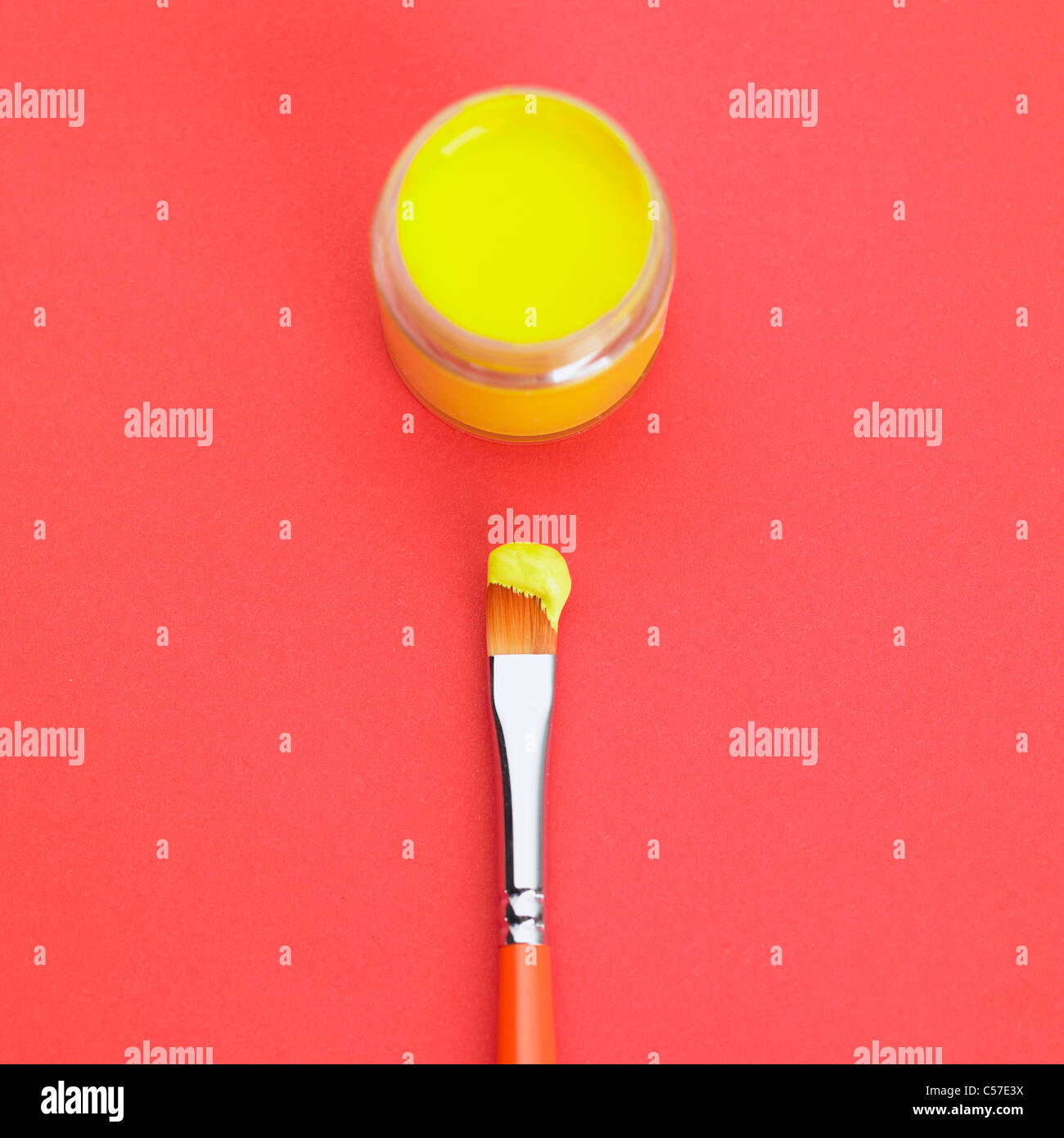 Paintbrush with yellow poster color Stock Photo - Alamy