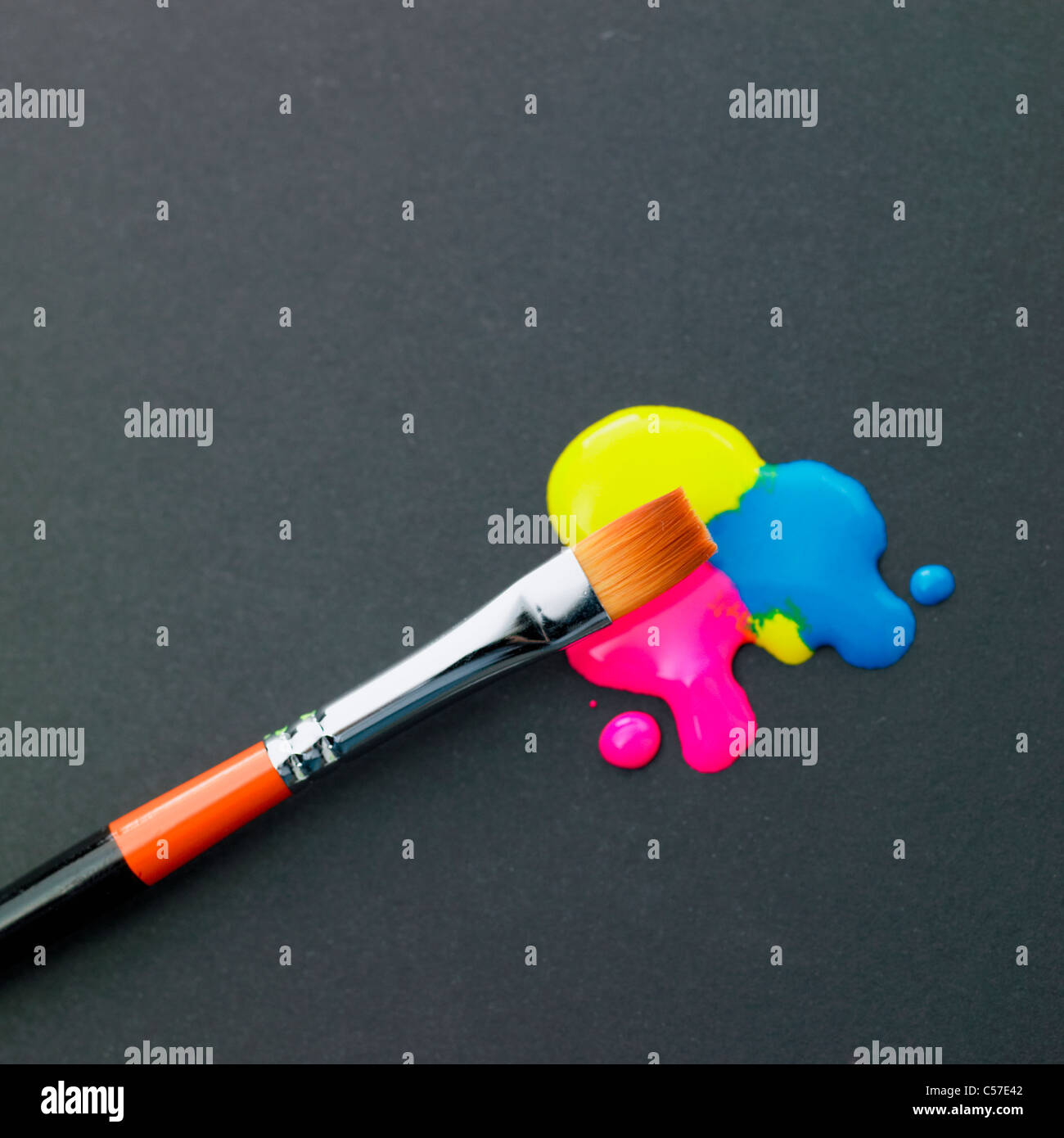 Paintbrush with poster color Stock Photo - Alamy