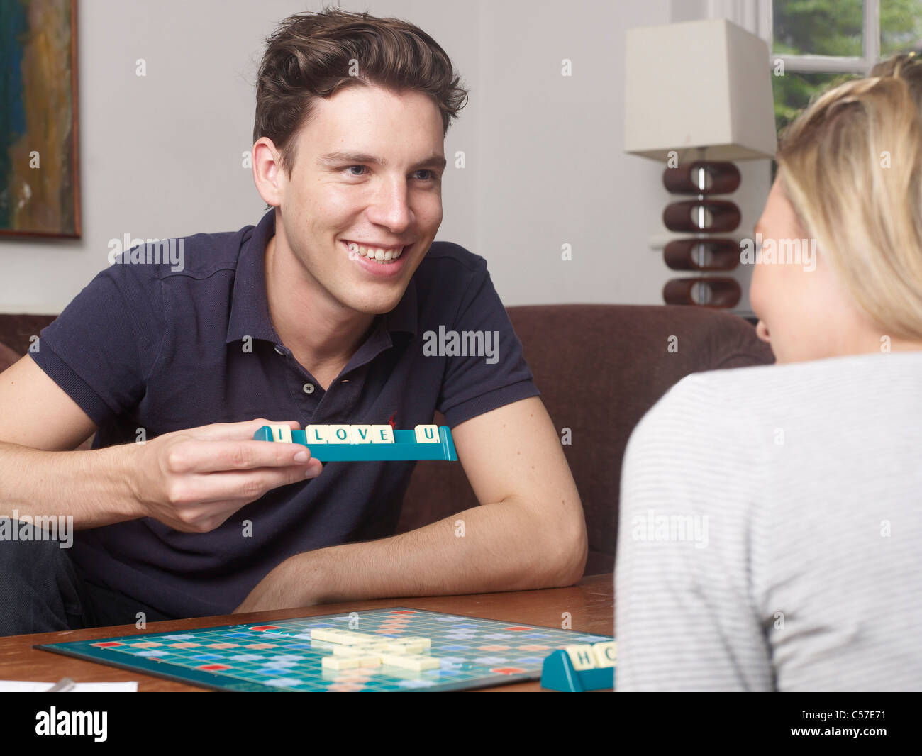 Couple playing scrabble together Stock Photo - Alamy