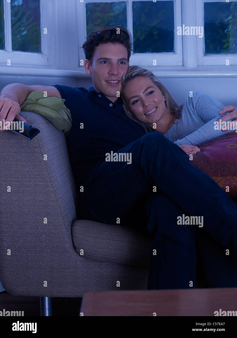 Couple watching television together Stock Photo - Alamy