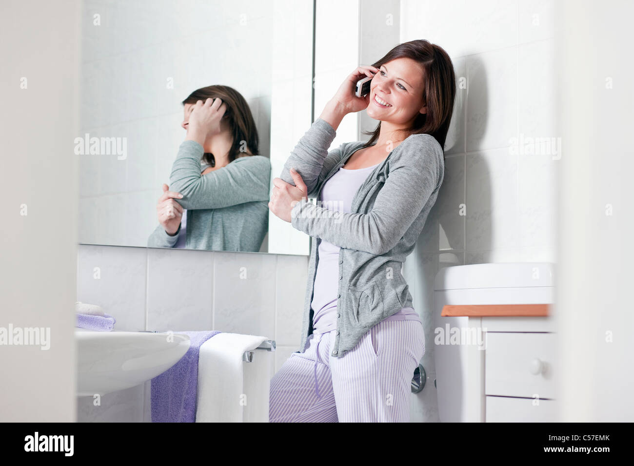 Woman chatting in bathroom hi-res stock photography and images - Alamy