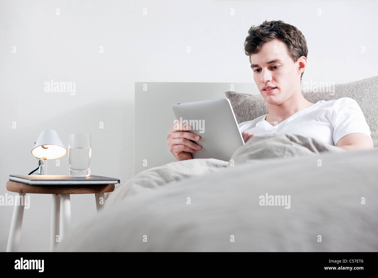 Young man unwinding in comfortable hi-res stock photography and images ...