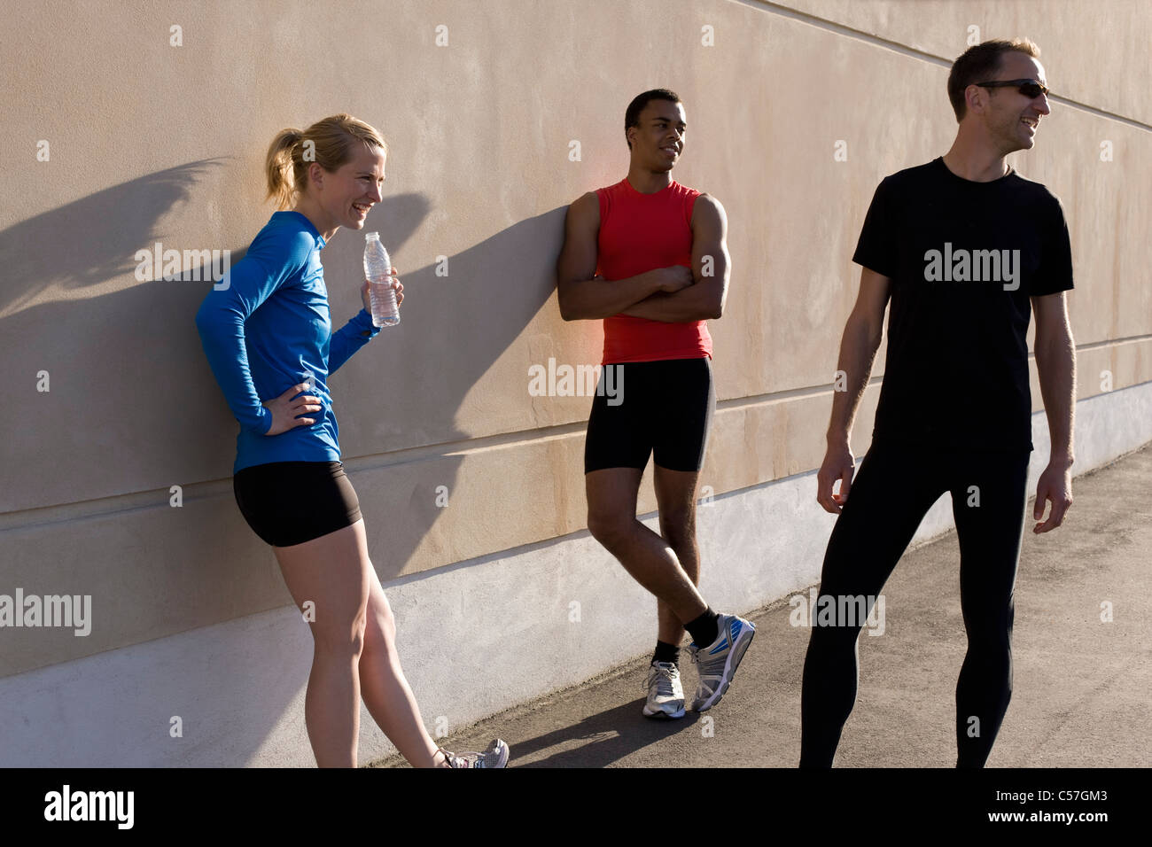 Friends talking after running together Stock Photo - Alamy