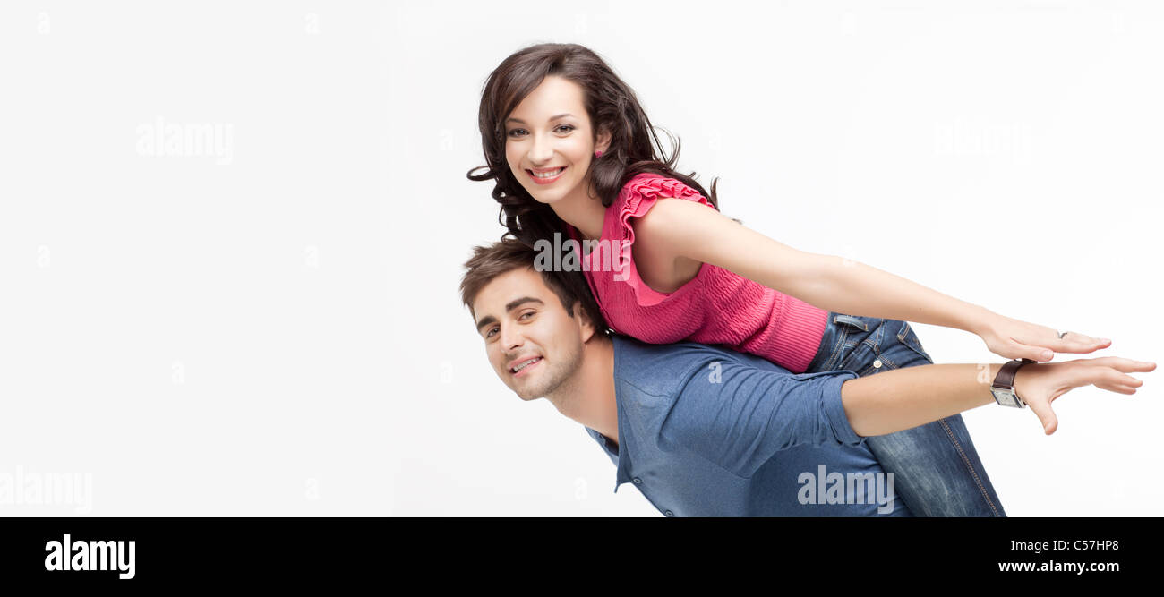 young playful involved couple posing as flying Stock Photo - Alamy