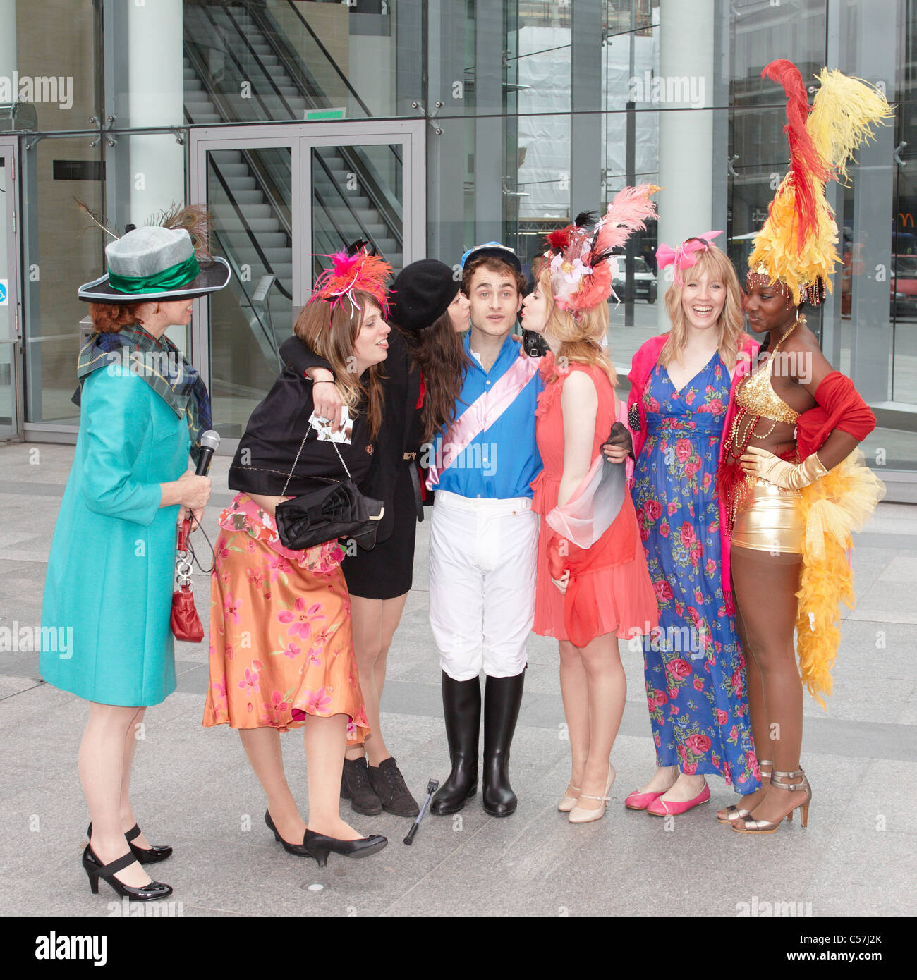Actors in costume reflecting the type of people expected to attend the ...