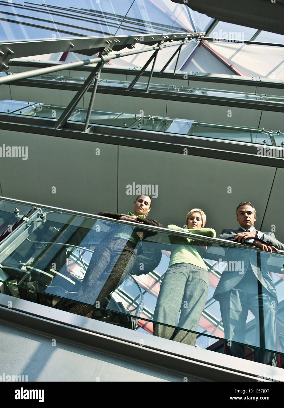 Business people standing on balcony Stock Photo - Alamy