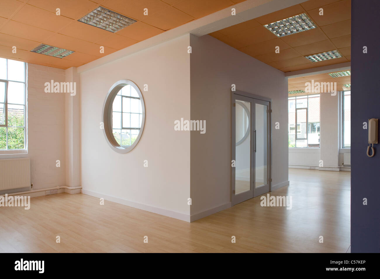 Renovated small empty office units with wooden floors Stock Photo - Alamy