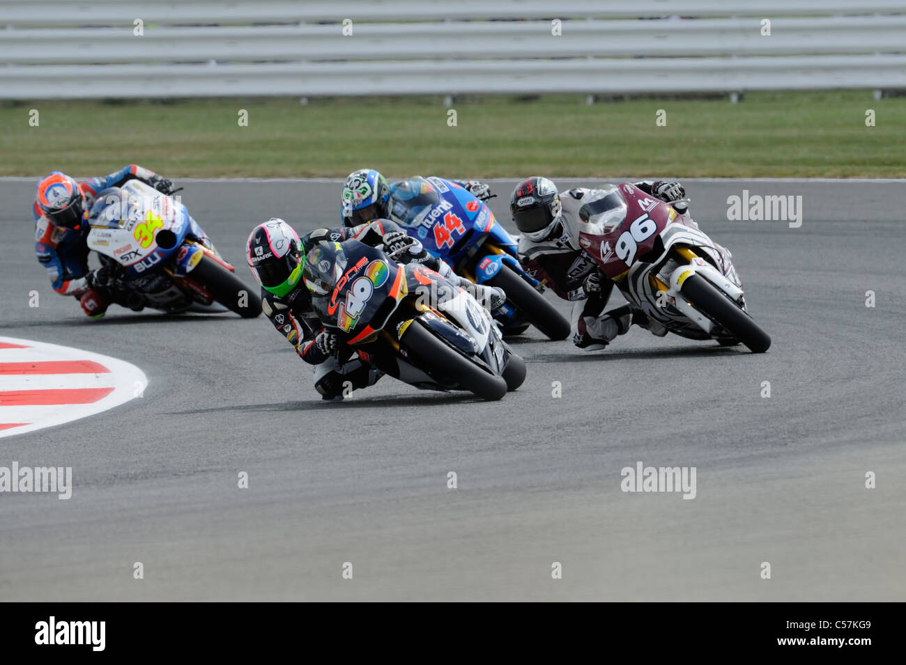 a group of riders in the moto 2 championship fight for track space ...