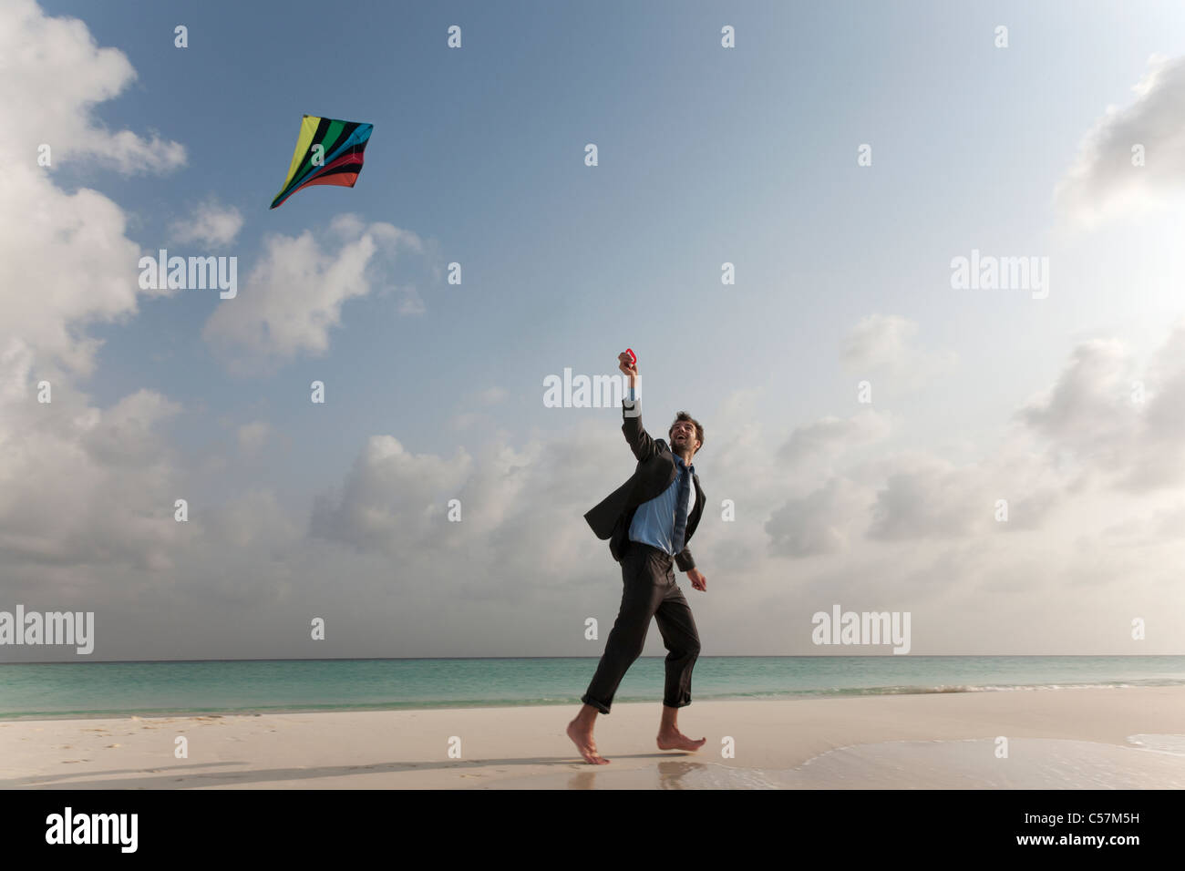 Flying kite beach hi-res stock photography and images - Alamy