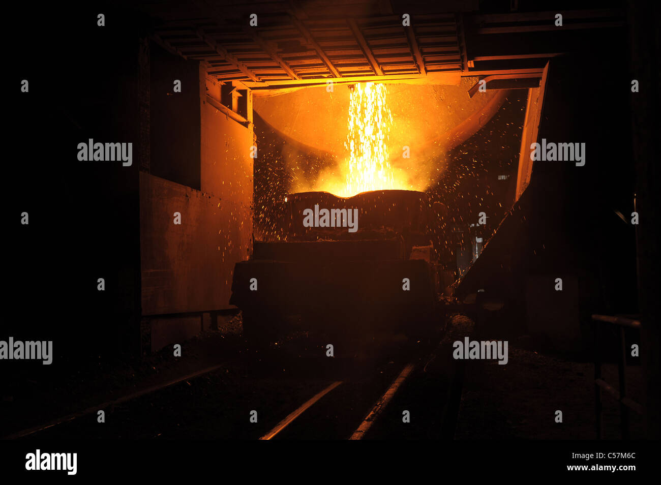 Liquid metal from casting ladle. Ferrous metallurgy Stock Photo - Alamy