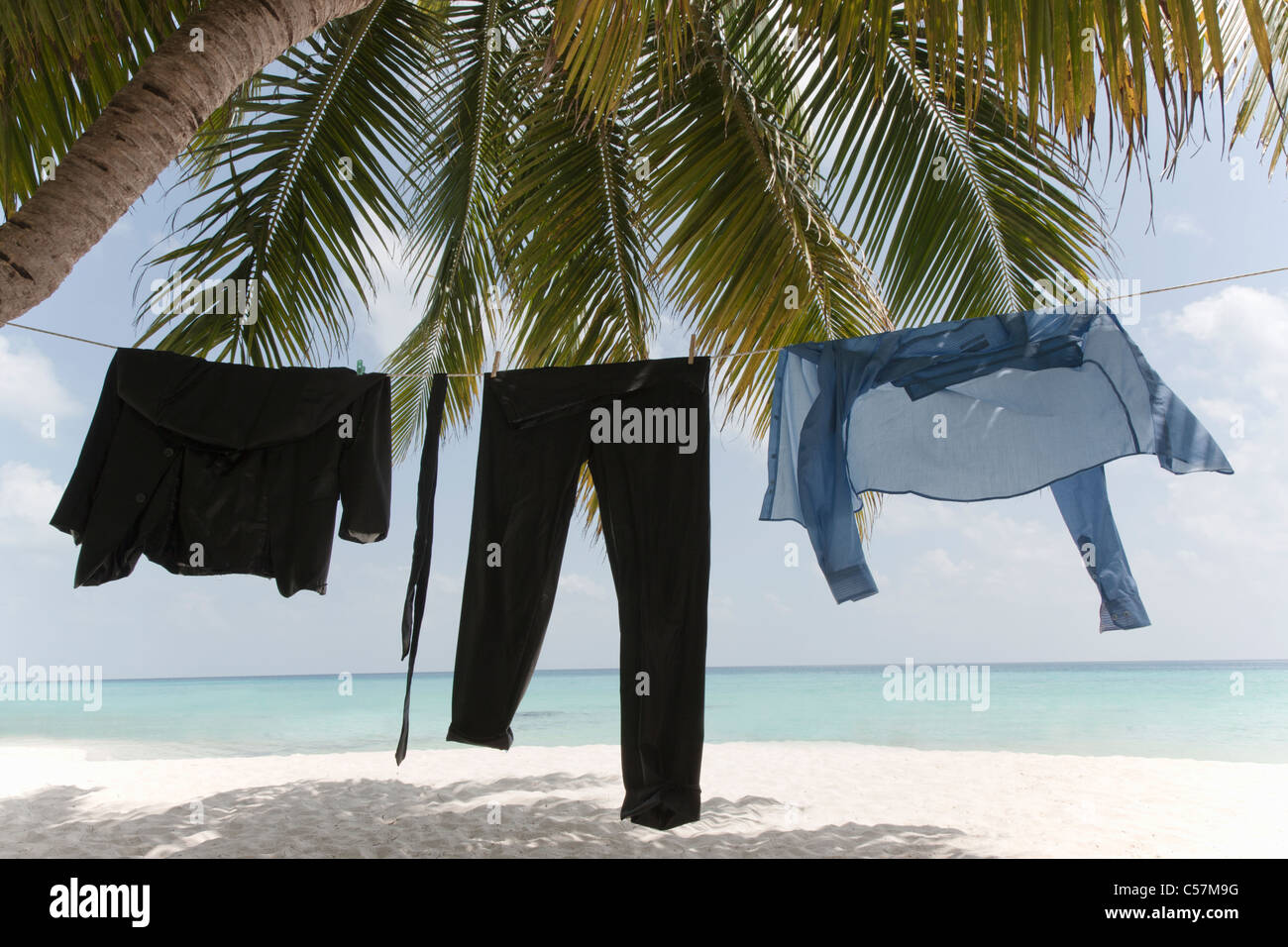 Business clothes drying on line on beach Stock Photo - Alamy