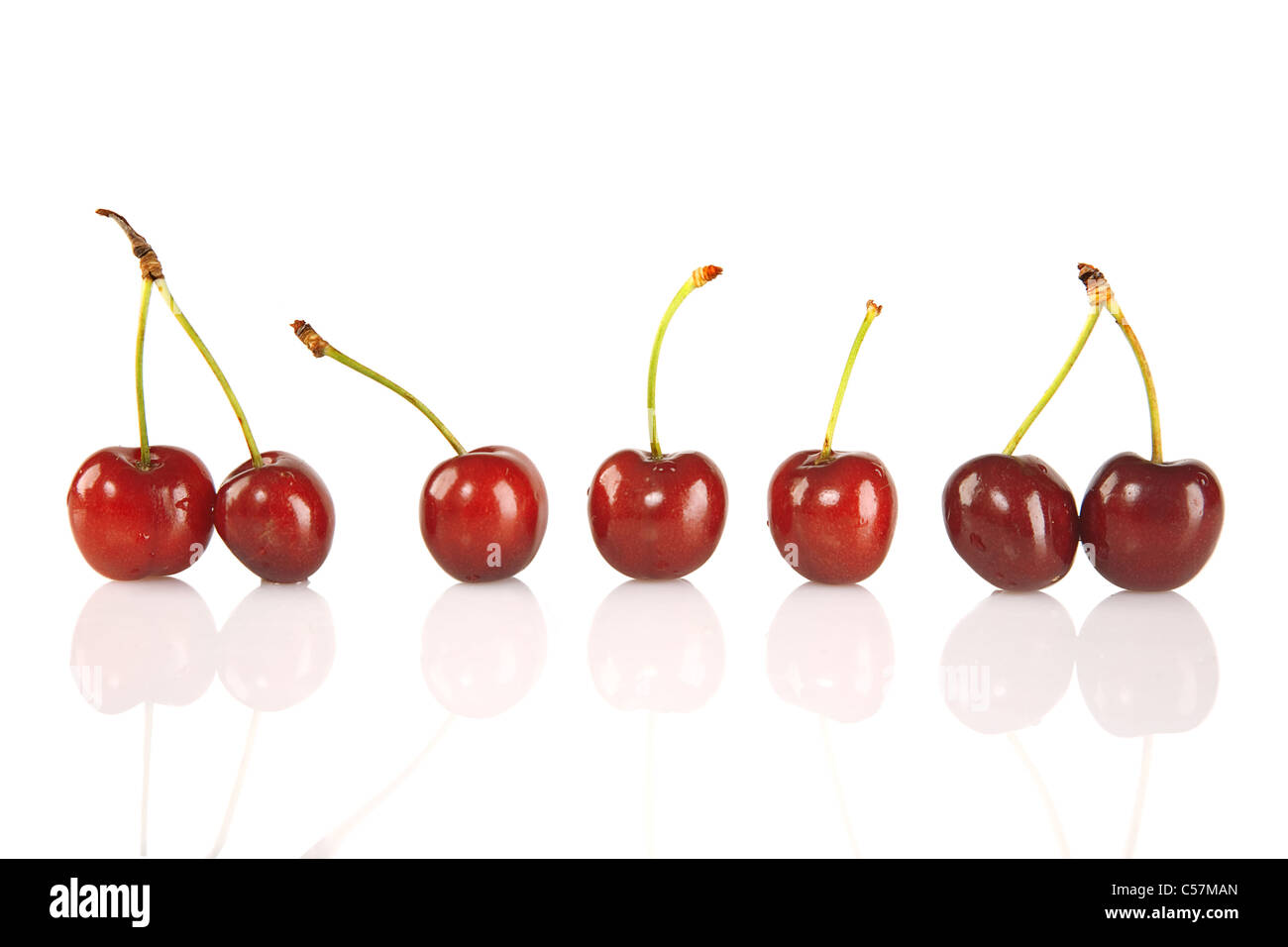Sweet red cherries isolated on a white background Stock Photo - Alamy