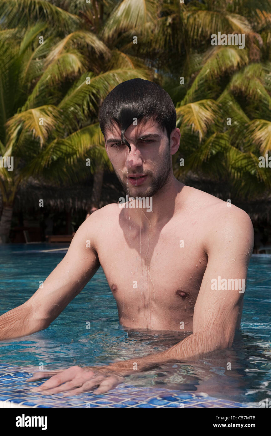 Man standing in pool Stock Photo - Alamy