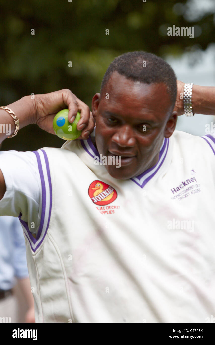 Devon Malcolm bowls at office workers in Canary Wharf, London, to ...