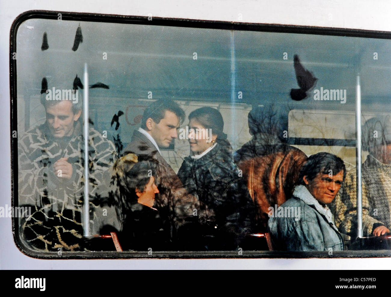 Passengers including a young couple photographed on a bus in the ...