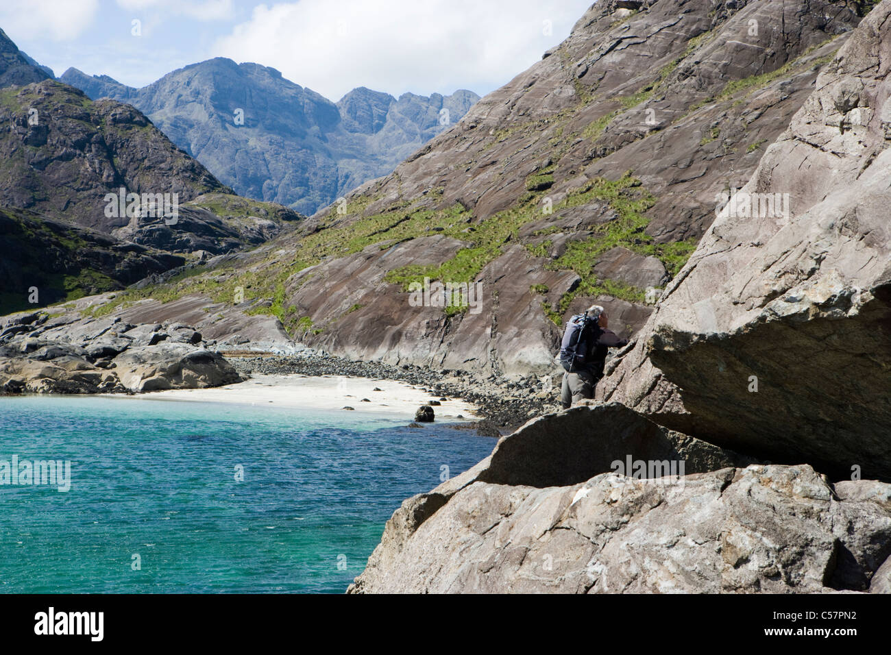 Walker crossing The Bad Step at the foot of Sgurr na Stri on Loch ...