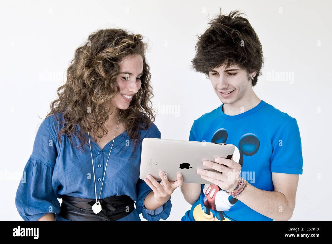 Boy and girl with Ipad Stock Photo - Alamy