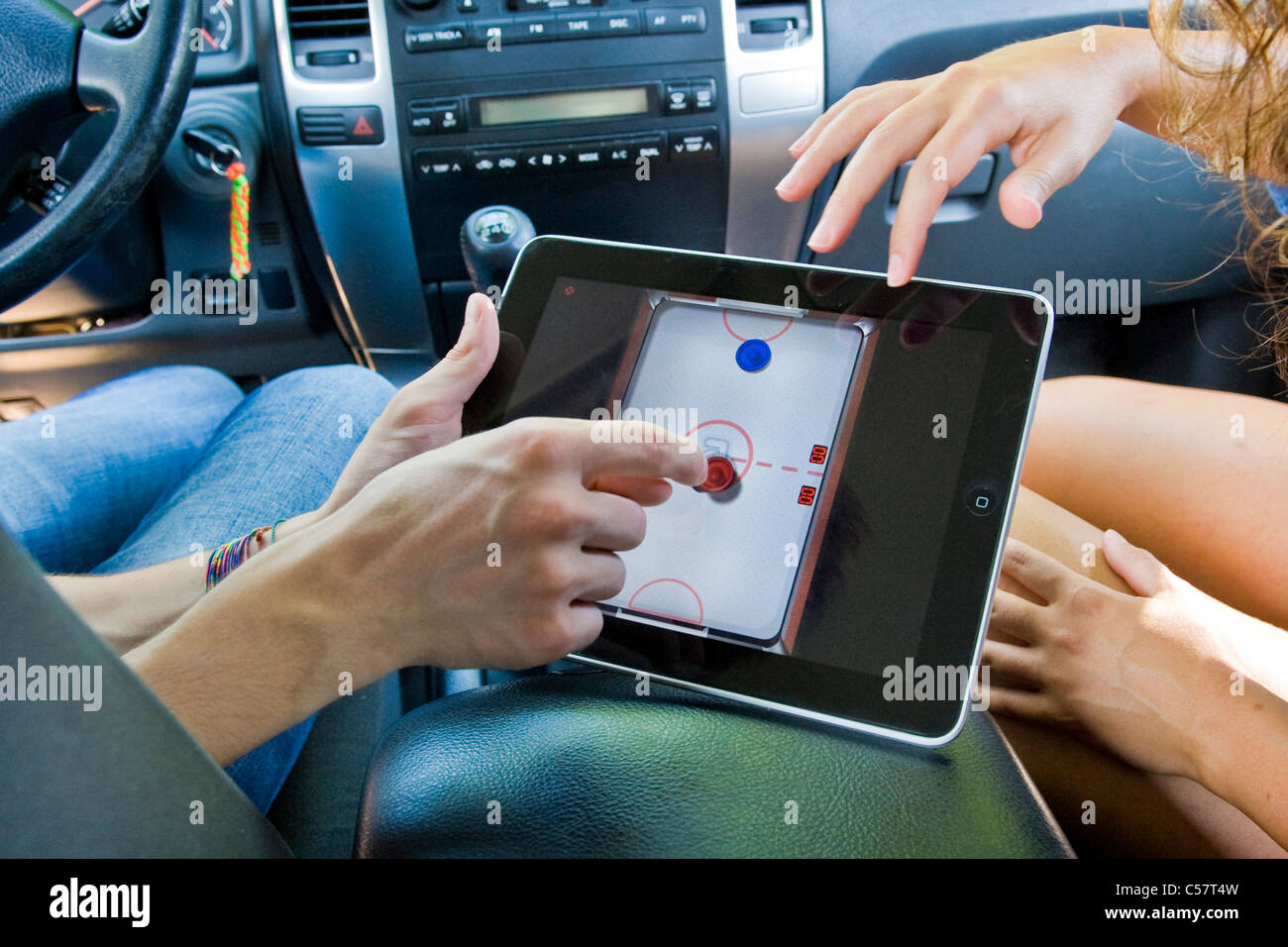 Boy and girl with Ipad Stock Photo - Alamy