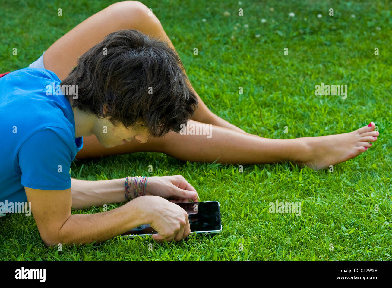Boy and girl with Ipad Stock Photo - Alamy