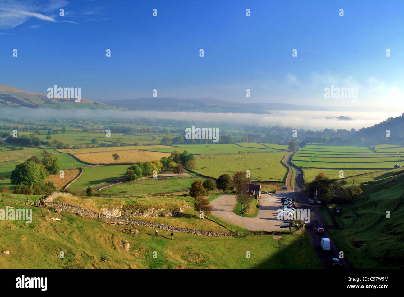 Mist lingers over Castleton in the Peak district Derbyshire England ...