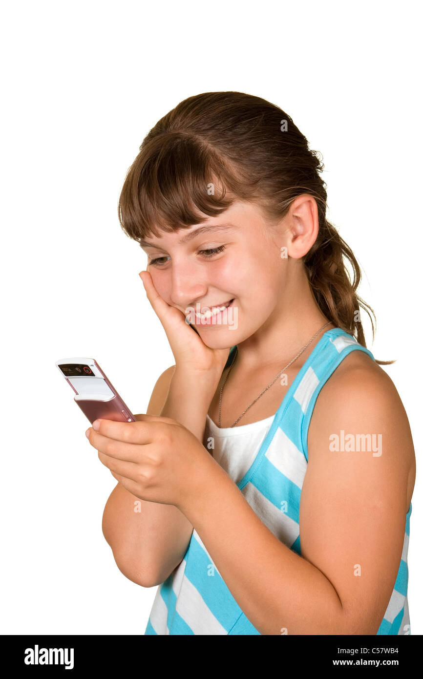The smiling girl with a mobile phone on a white background Stock Photo ...