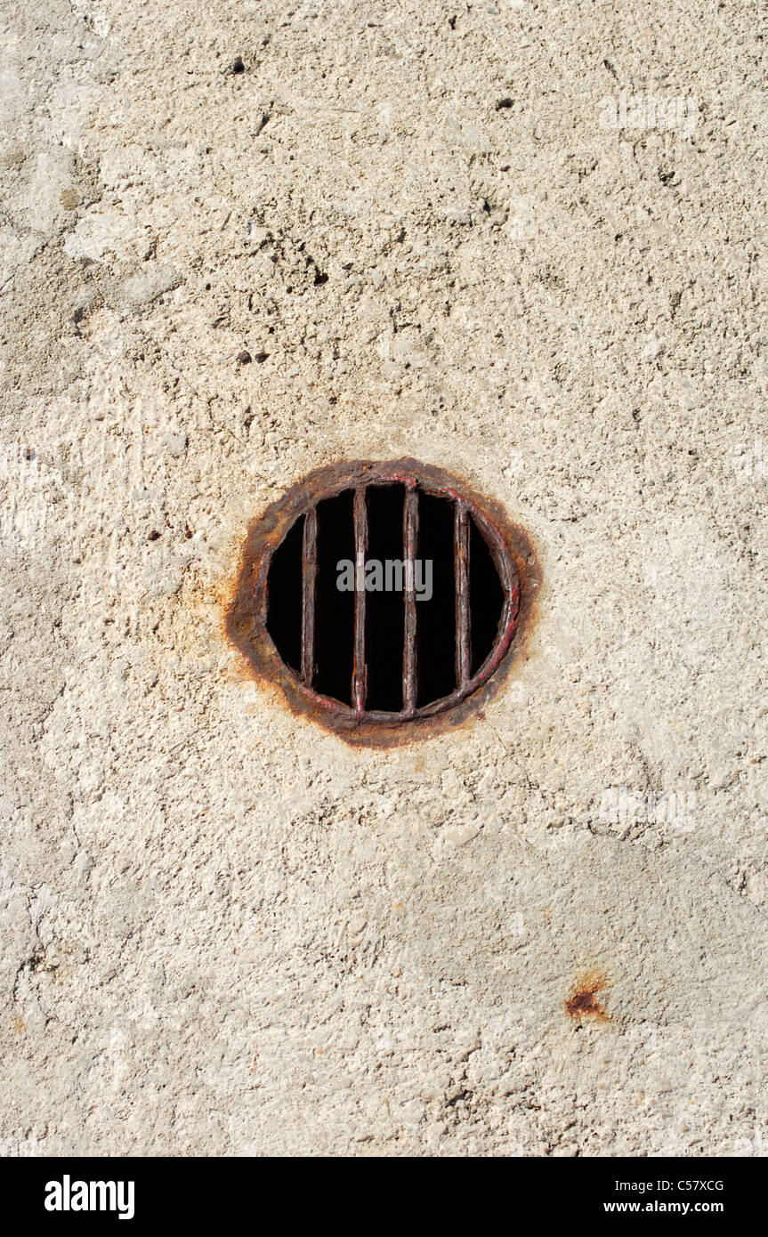 Rusty drain outlet in a wall Stock Photo - Alamy