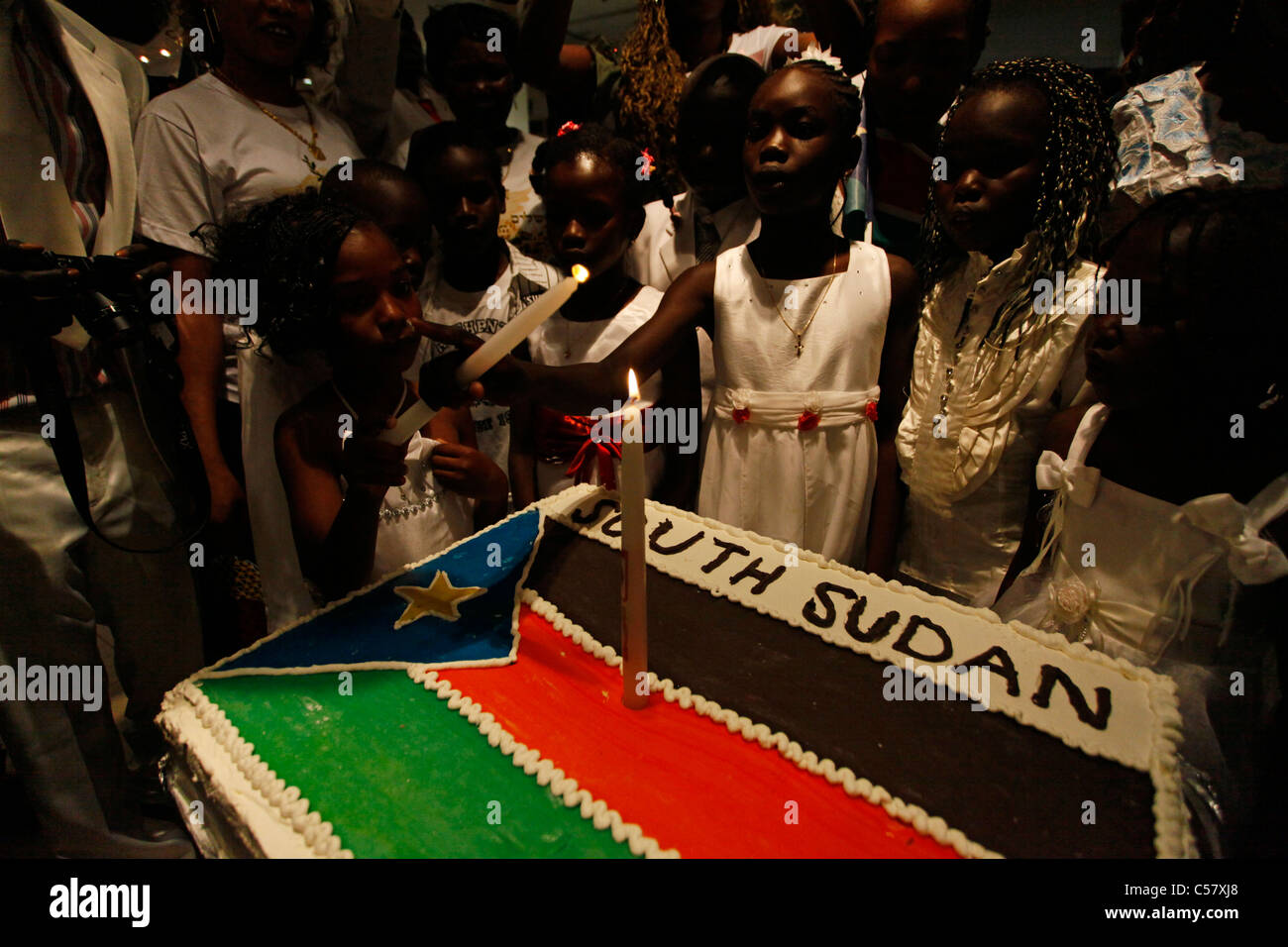 South Sudanese children celebrate with a Republic of South Sudan flag ...
