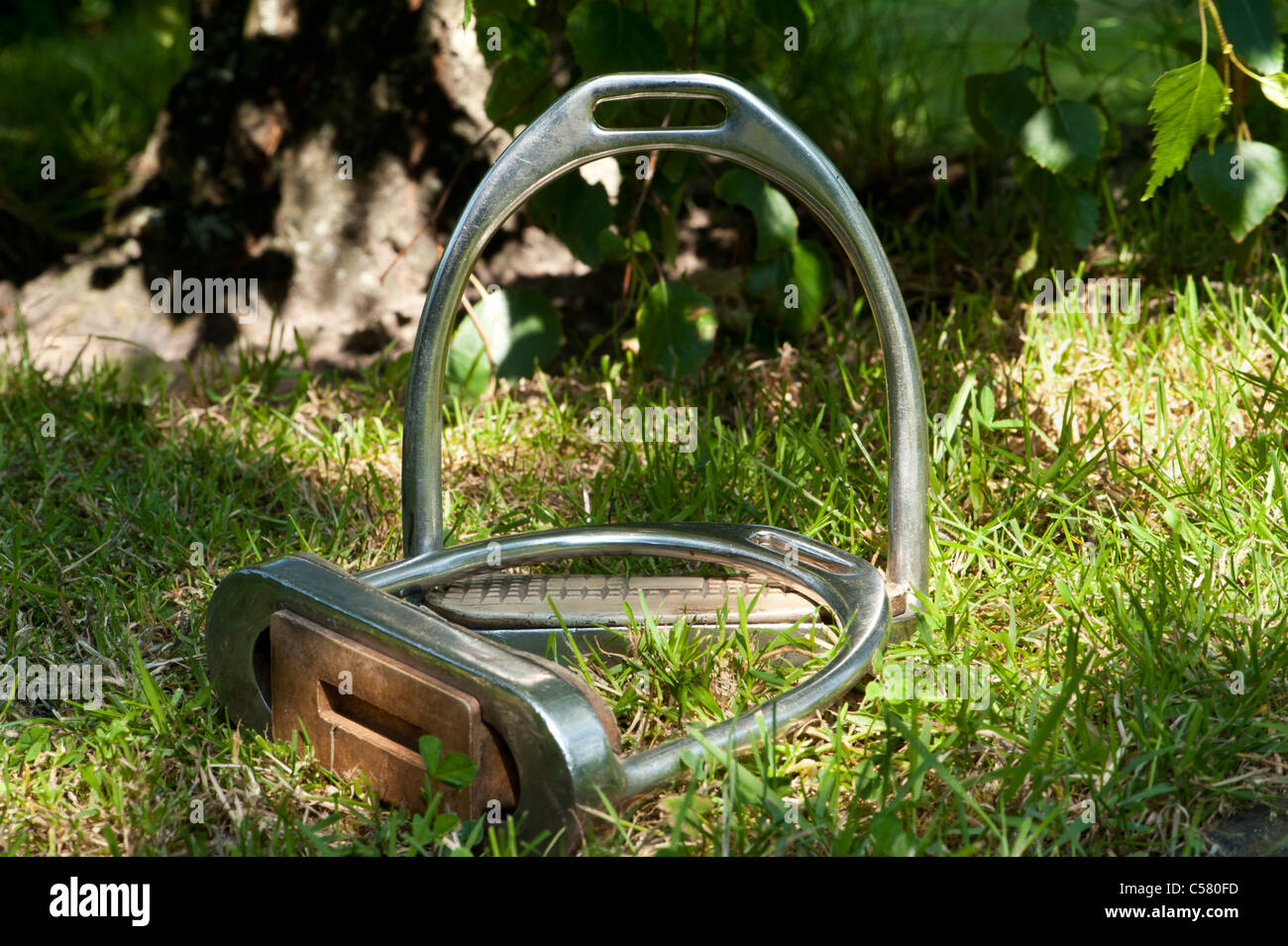 Stirrup irons for equestrian use laying in grass UK equestrian Stock ...