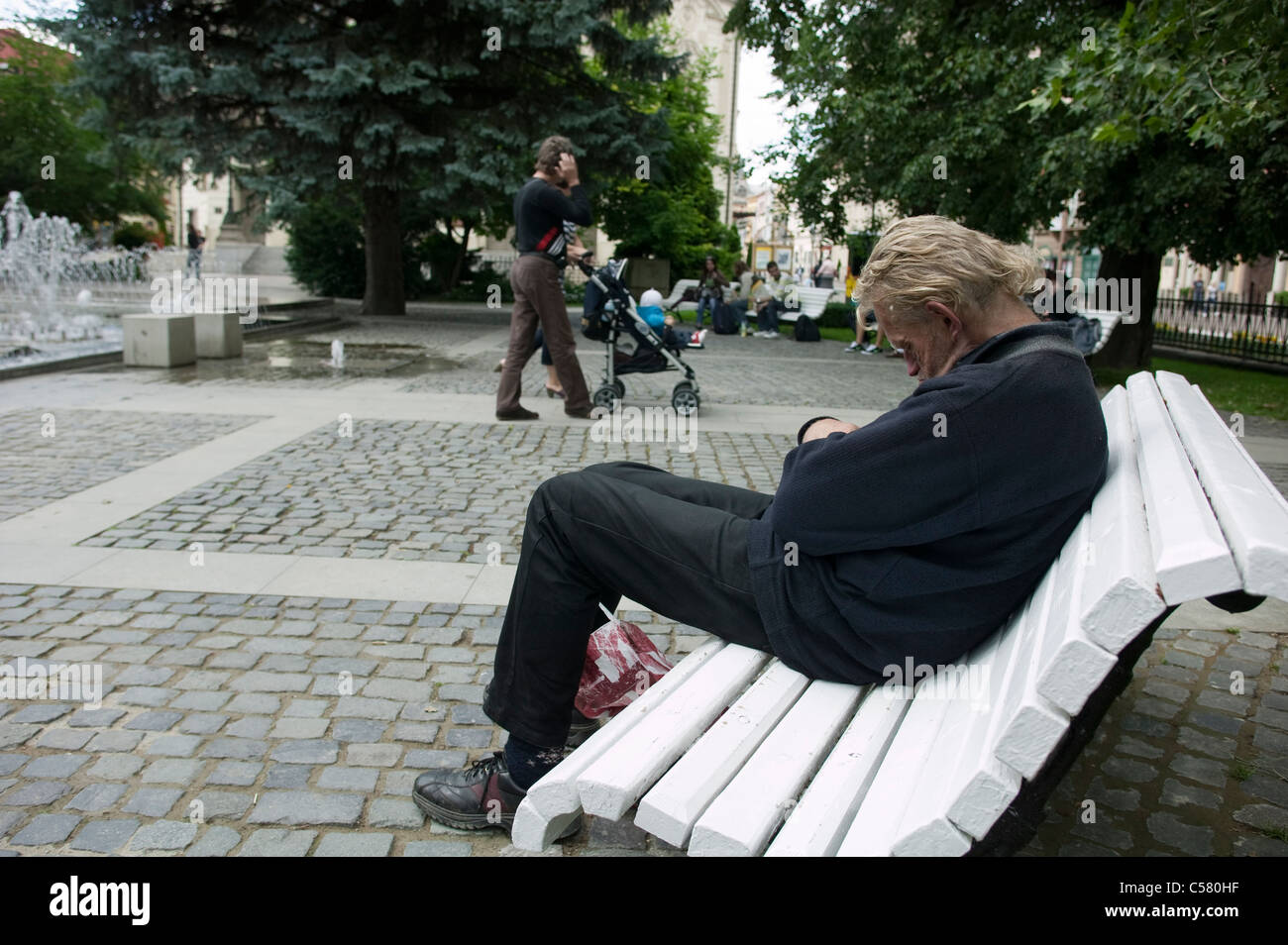 A slovakian homeless alcoholic sitting on a park bench Stock Photo - Alamy