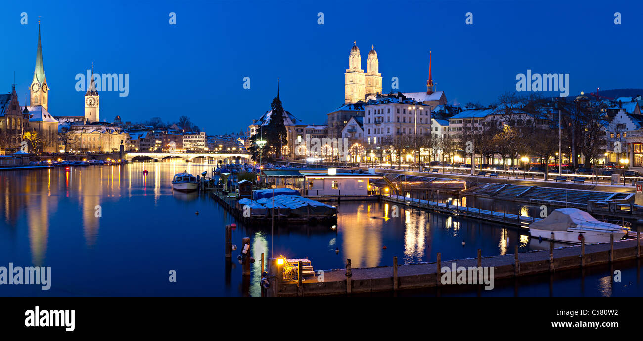 Zurich, financial center seen from river Limmat at night with historic ...
