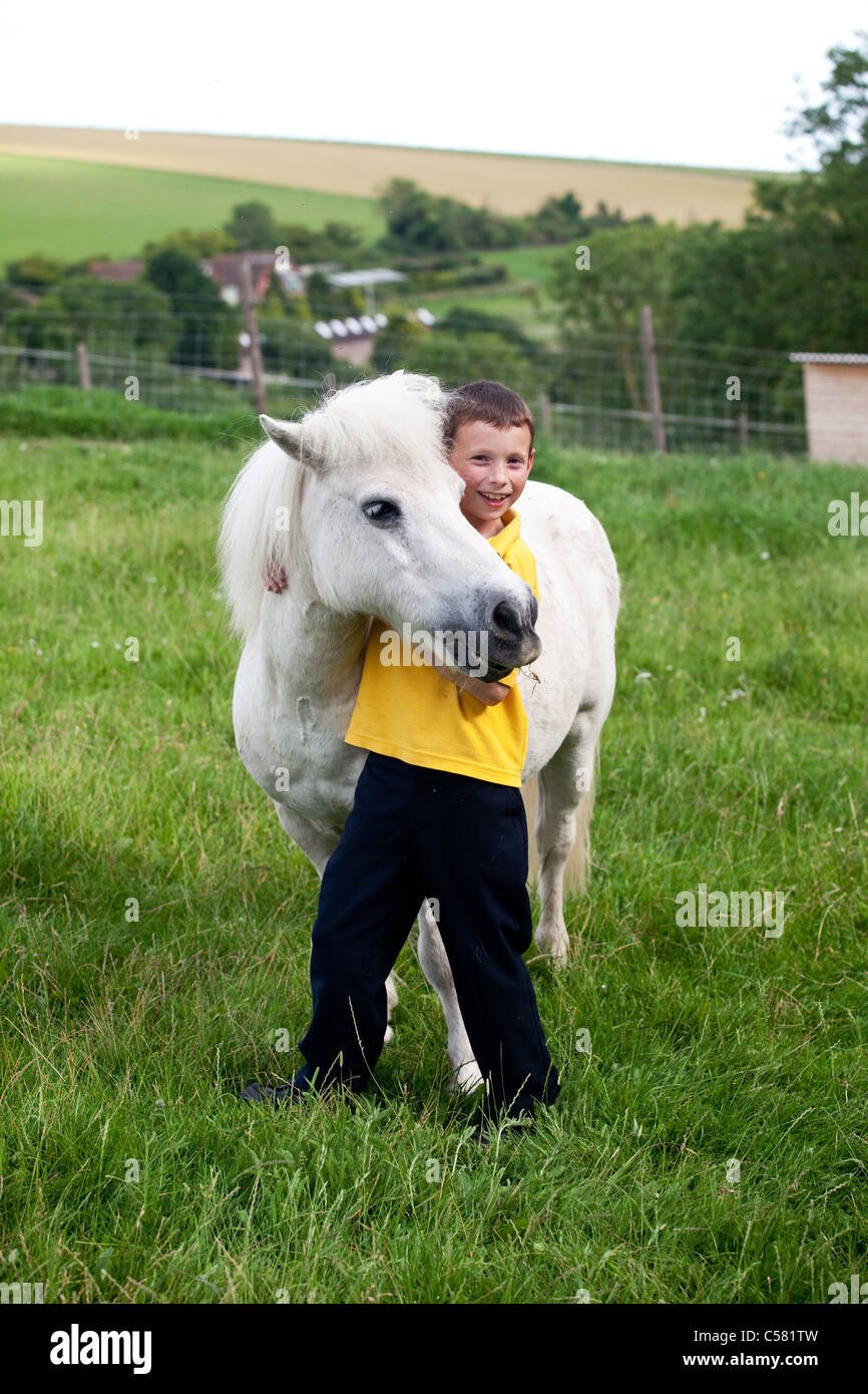 Cute boy and pony hi-res stock photography and images - Alamy