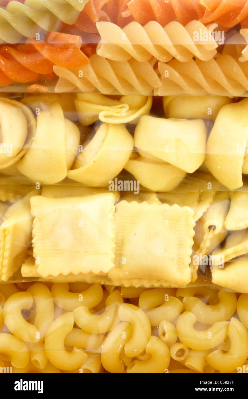 beautiful fresh and raw wholegrain assorted packaged pasta . shallow ...
