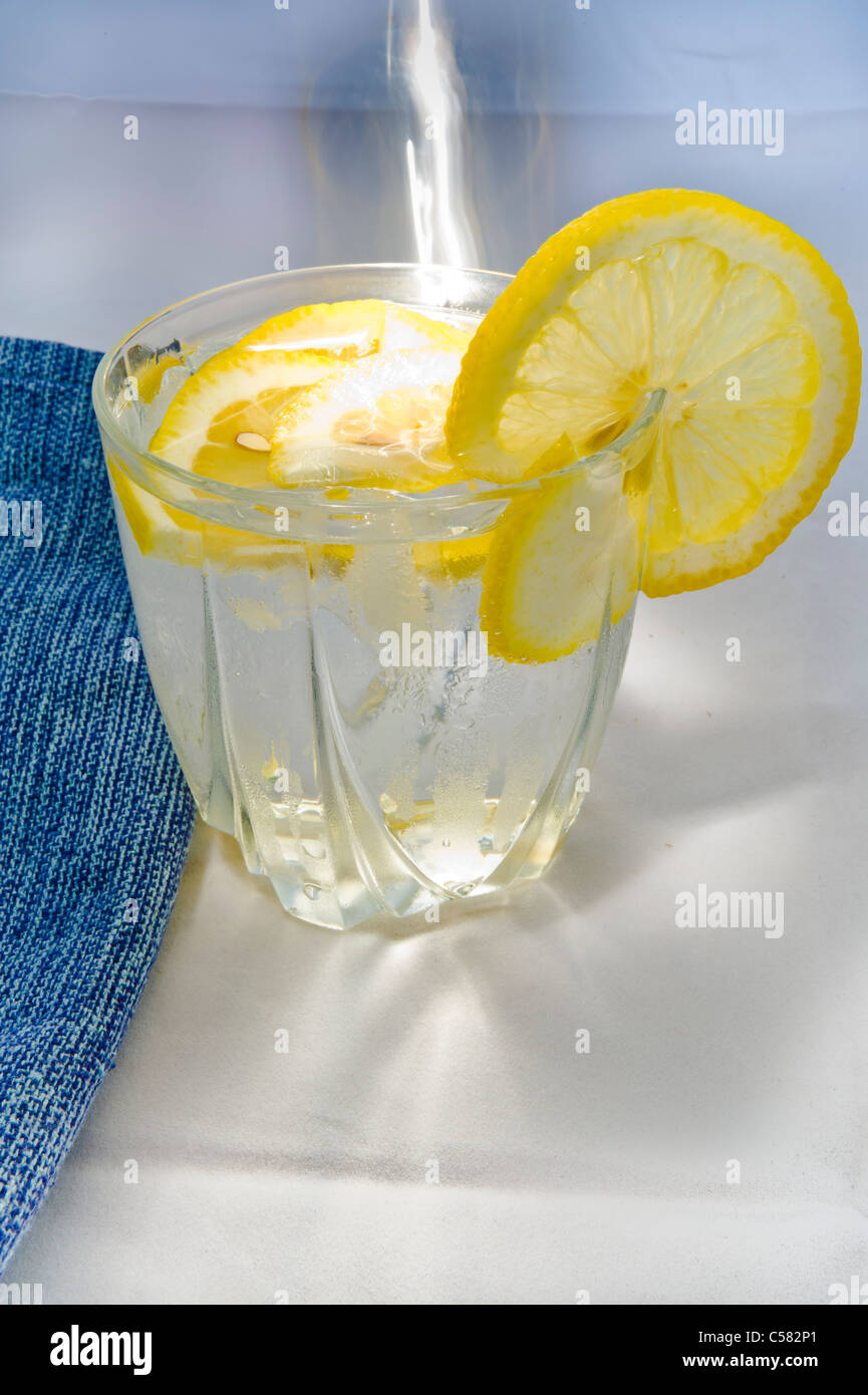 Refreshing ice water and slices of Lemon Stock Photo - Alamy