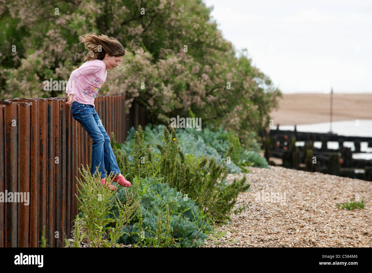 Child jumping off wall hi-res stock photography and images - Alamy
