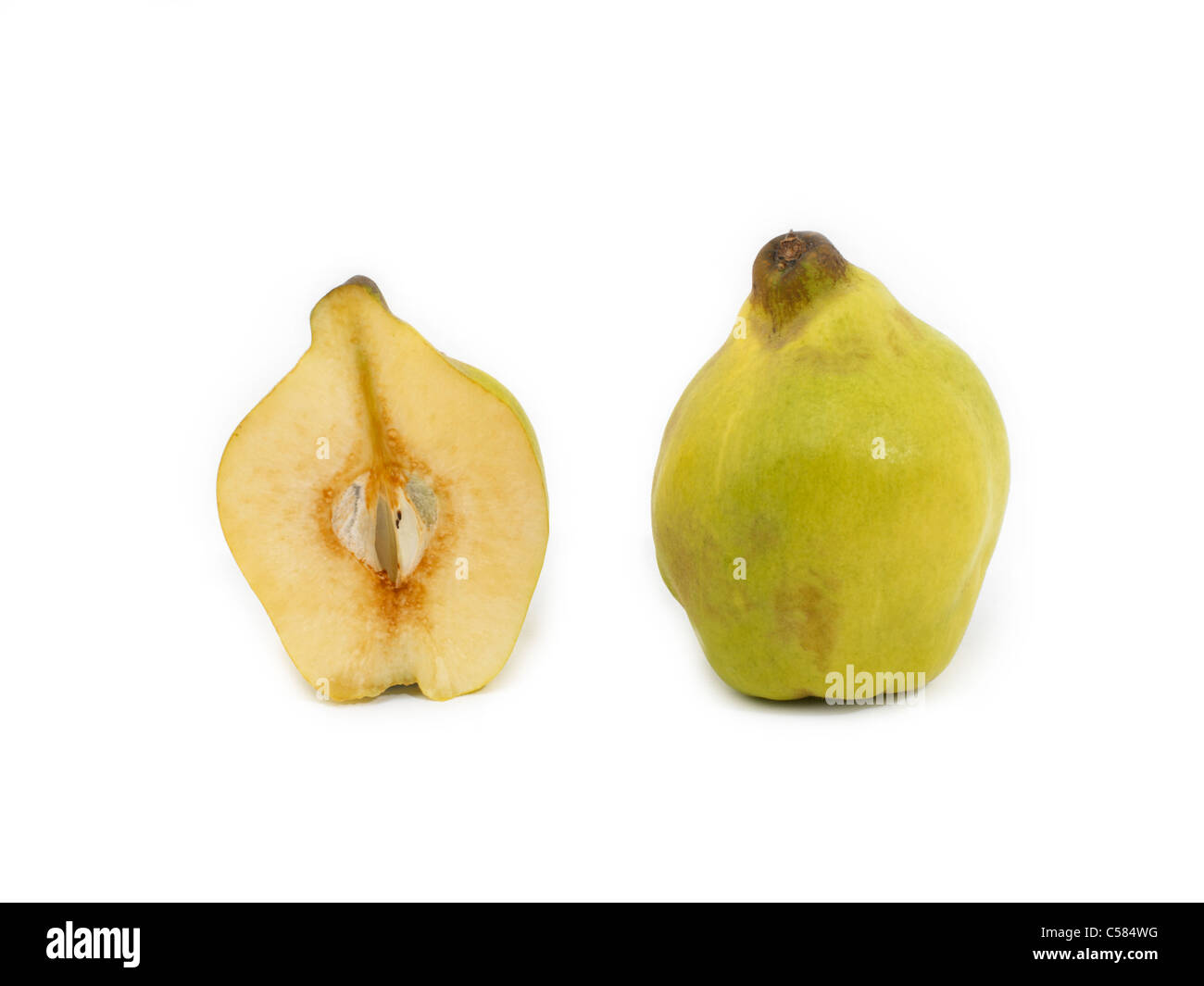 Quince Pear Whole and Half Stock Photo - Alamy